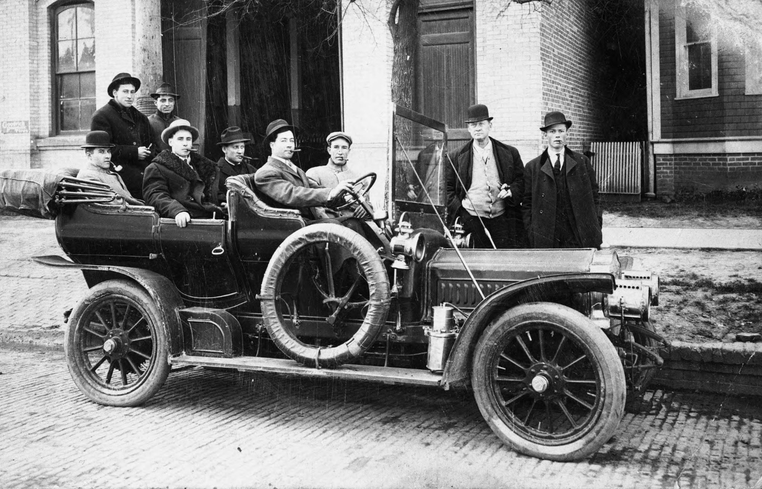 Men in an open touring car - A Curious Histonian